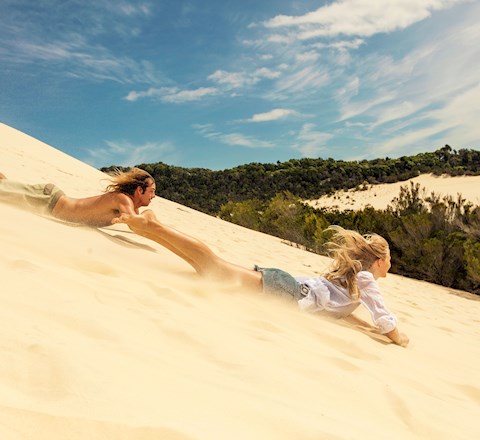 Sand Tobogganing at Tangalooma | Moreton Island Desert Tour